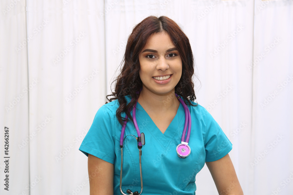Portrait of a young attractive hispanic female healthcare worker, nurse ...