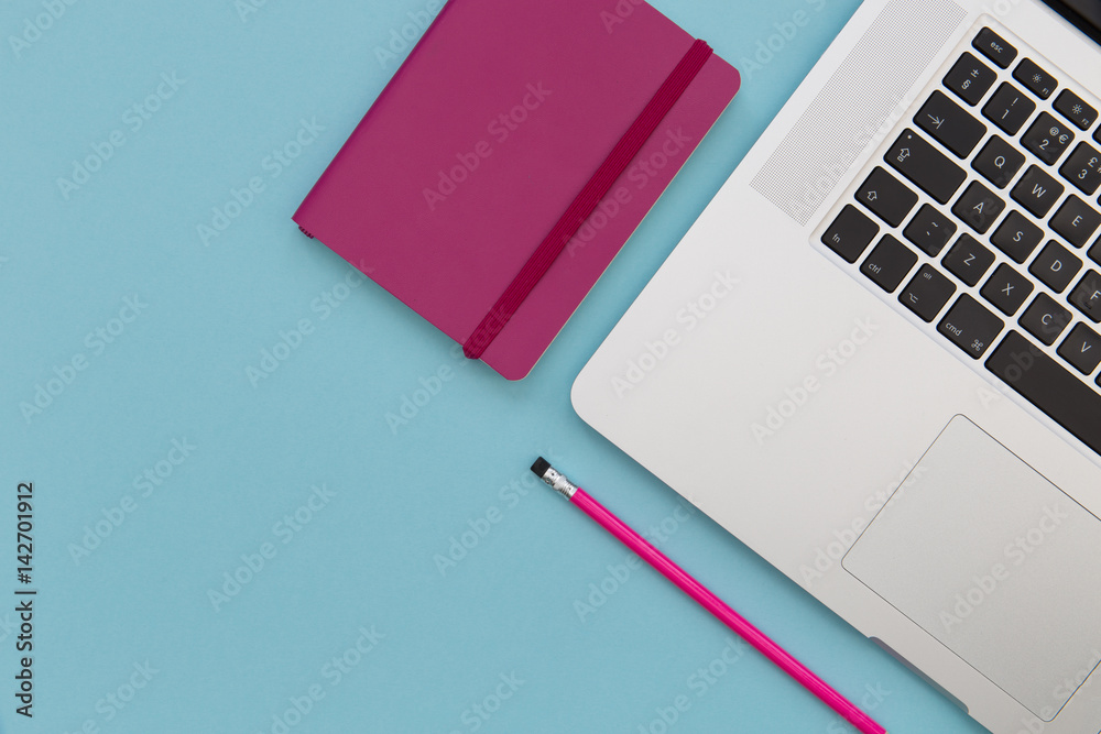 Notebook laptop and pencil overhead on colorful blue background Stock ...