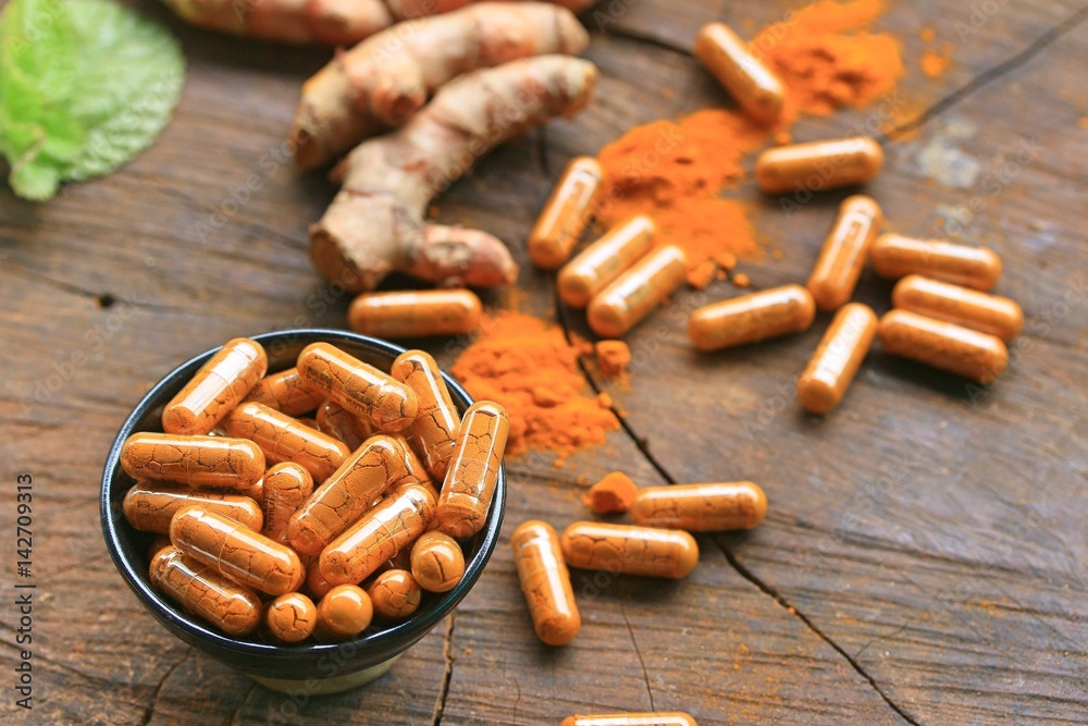 Turmeric capsule Stock Photo | Adobe Stock