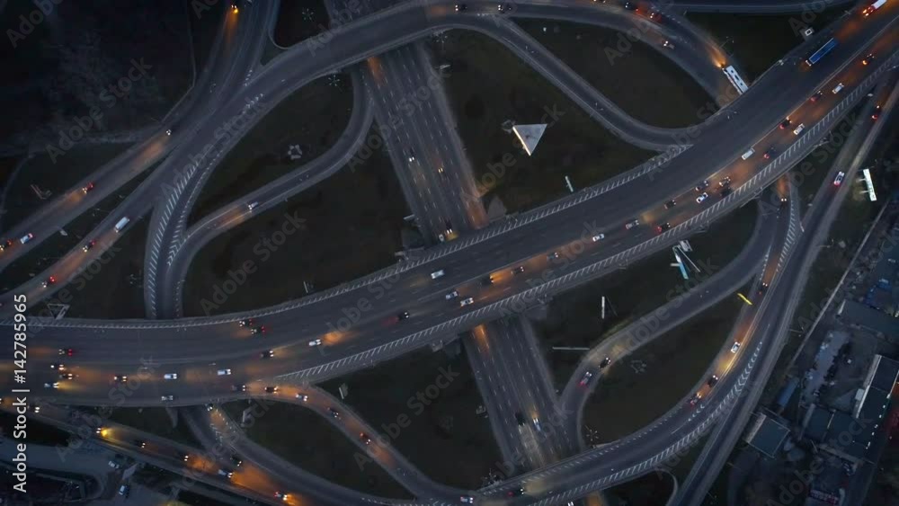 Vertical top down aerial view of traffic on freeway interchange at ...