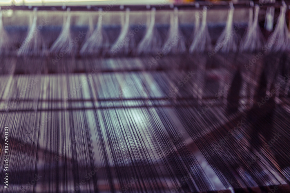 Abstract background of thread on bobbin prepared for weaving and making ...