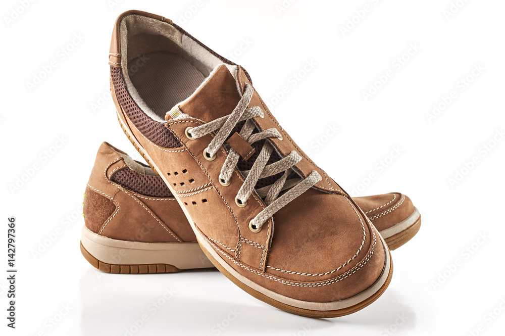 Pair of men's shoes front view. Brown leather sneakers isolated on ...