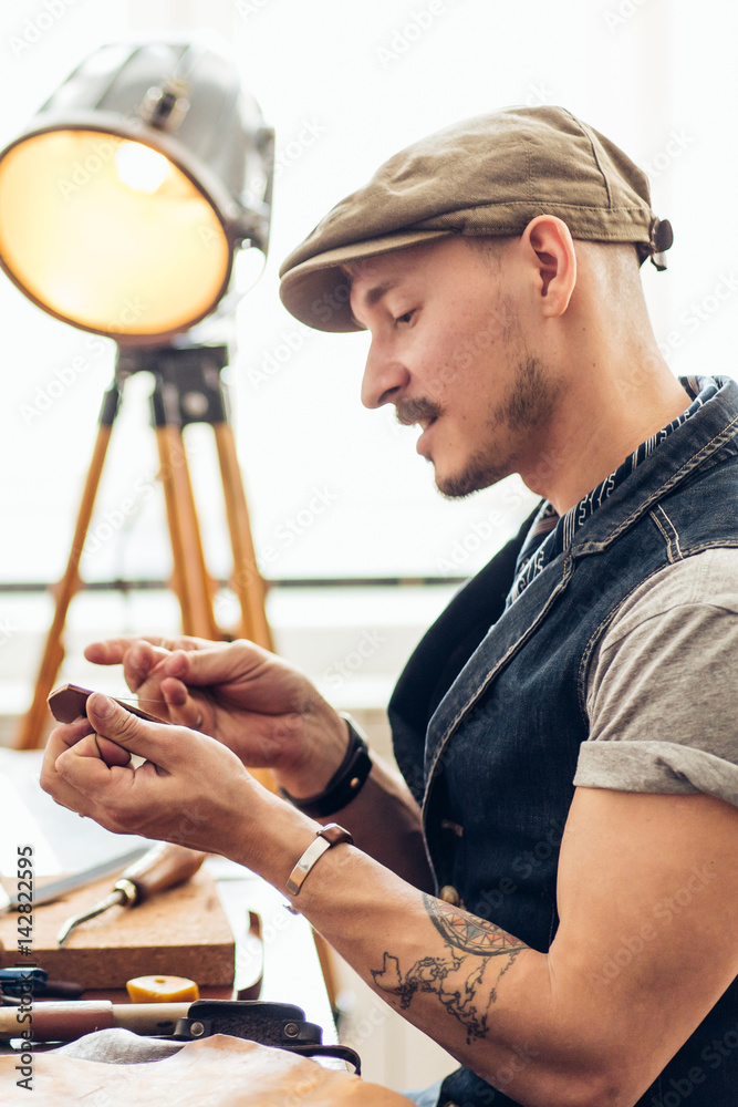 caucasian leather craft mustache man wearing cup working as artisan in ...