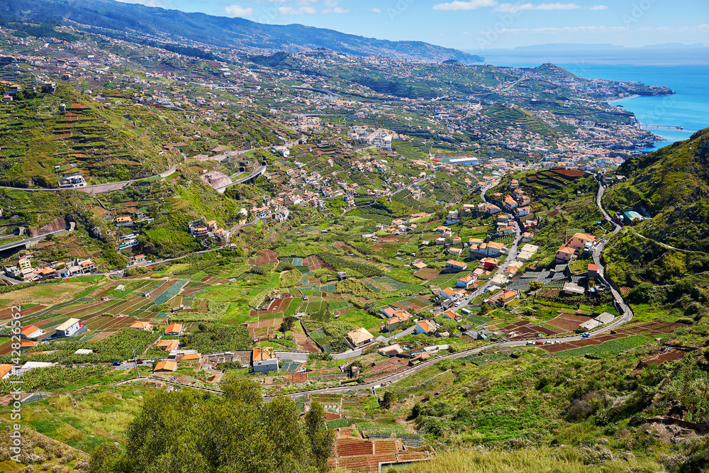 Typical Madeira landscape with little villages, terrace fields and ...