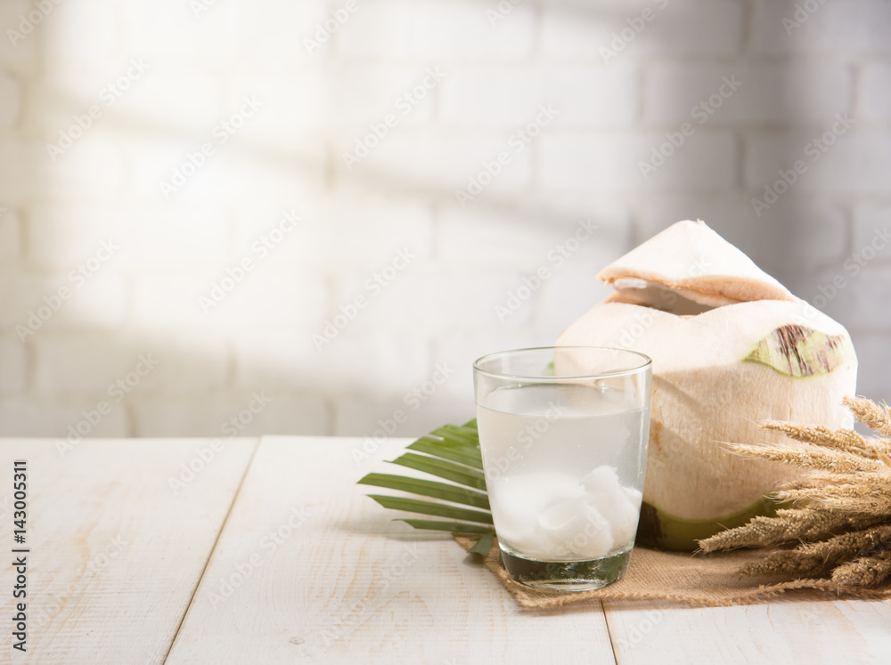 Coconut juice,Drink coconut water on table with shadows from a window ...