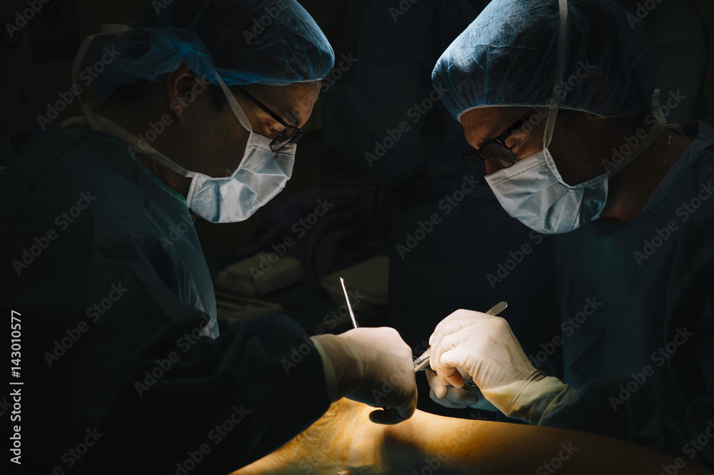 Surgeons making an Achilles tendon operation Stock Photo | Adobe Stock