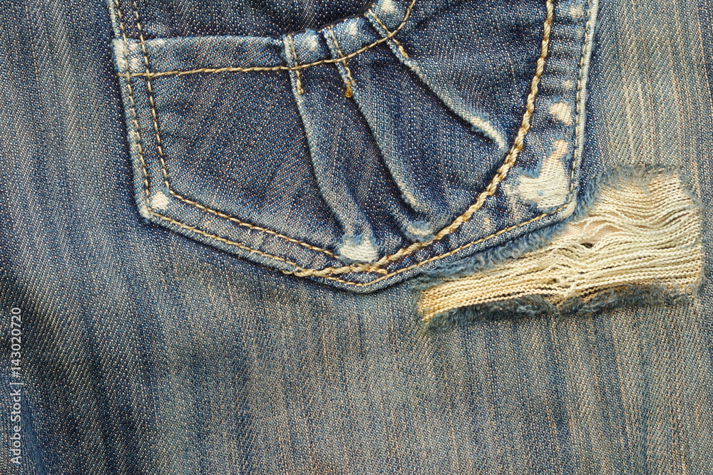 Blue denim jeans present the old denim look and old damaging fabric ...