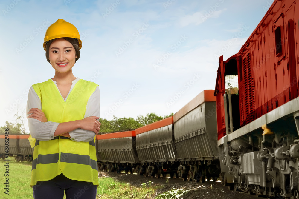 Beautiful asian railway employee woman standing beside freight train ...
