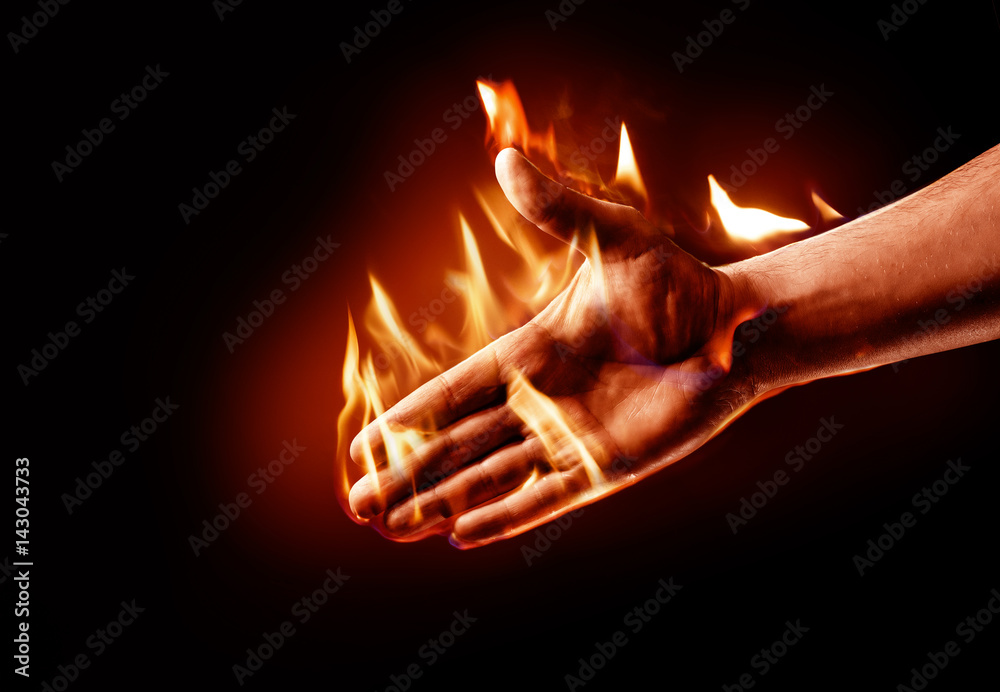 Hand on fire reaching out to shake Stock Photo | Adobe Stock