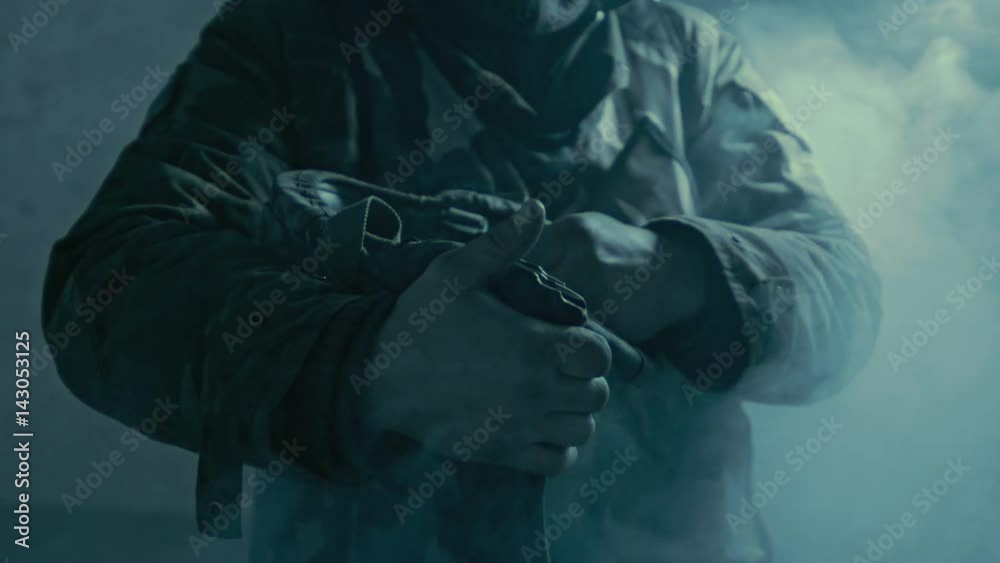 Soldier silhouette. Soldier loading bullet to magazine. Soldier ...