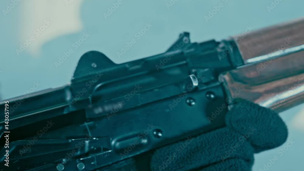 Removing fuse ak 47. Charging machine gun. Close up of charging rifle ...