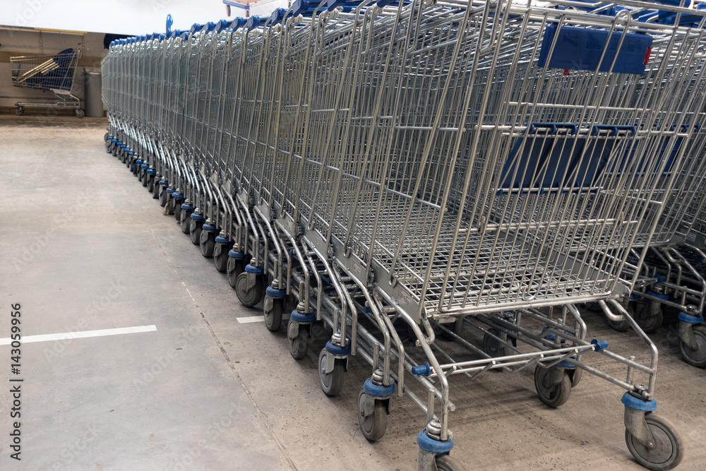 Shopping carts on a parking lot. Stock Photo | Adobe Stock