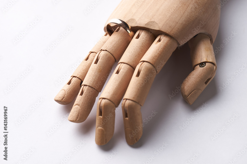 Prosthetic Wooden Hand with wedding ring on ring-finger isolated on ...
