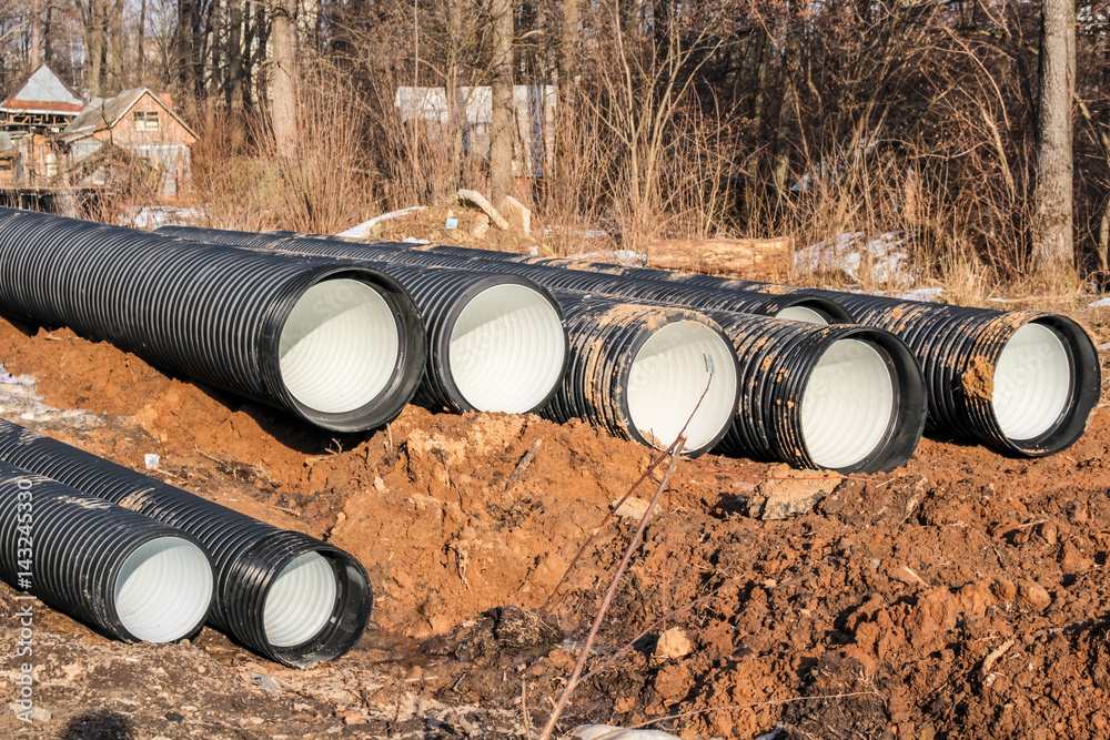 Pipeline laying. Plastic pipes Stock Photo | Adobe Stock