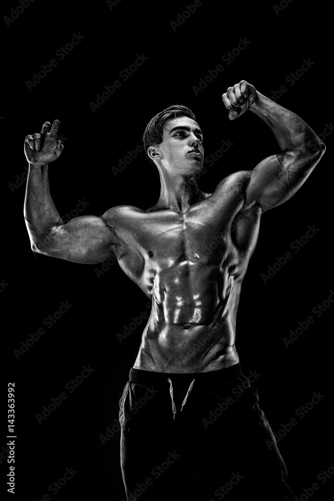 Strong bodybuilder with six pack, perfect abs, shoulders, biceps ...