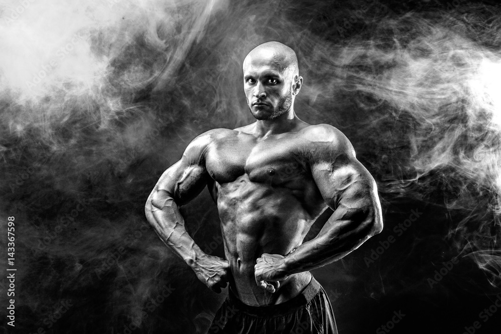 Strong bald bodybuilder with six pack. Bodybuilder man with perfect abs ...