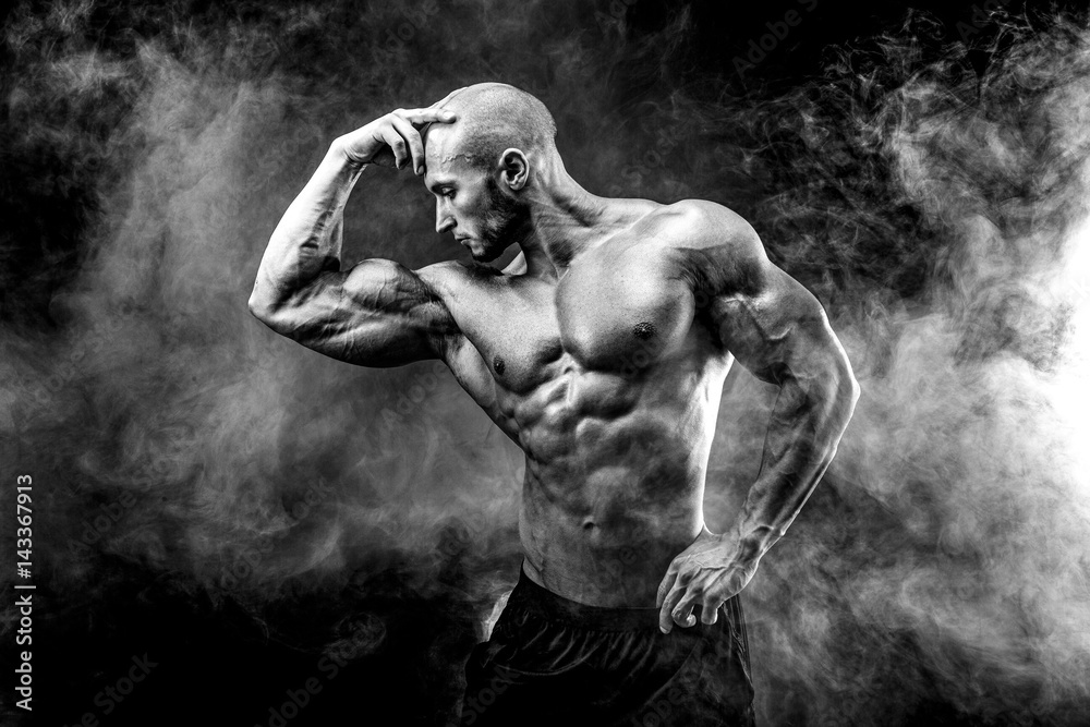 Strong bald bodybuilder with six pack. Bodybuilder man with perfect abs ...