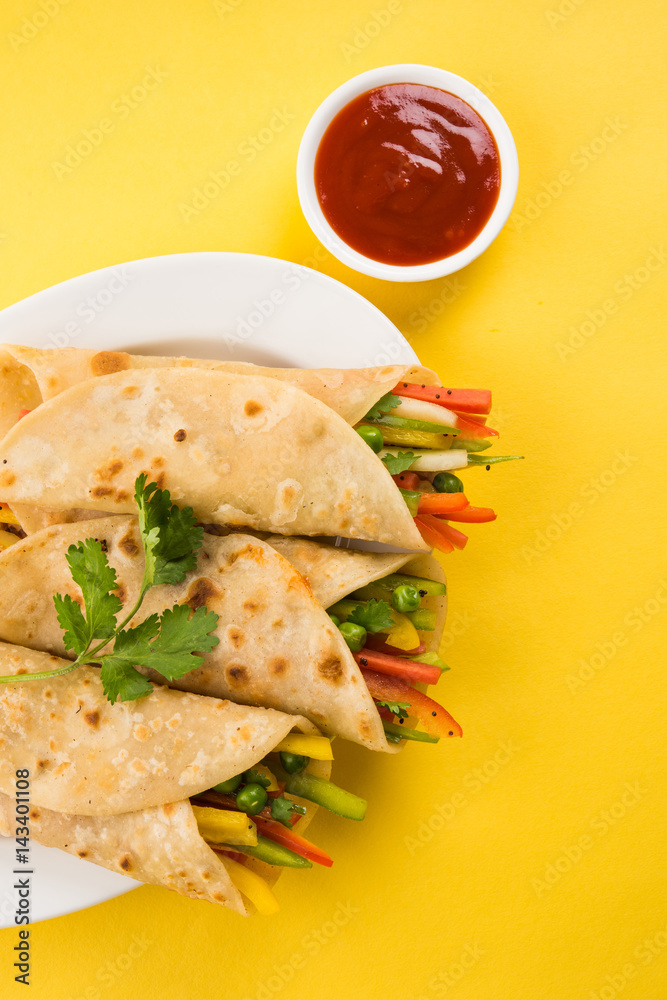 Indian popular snack food called Vegetable spring rolls or veg franky ...