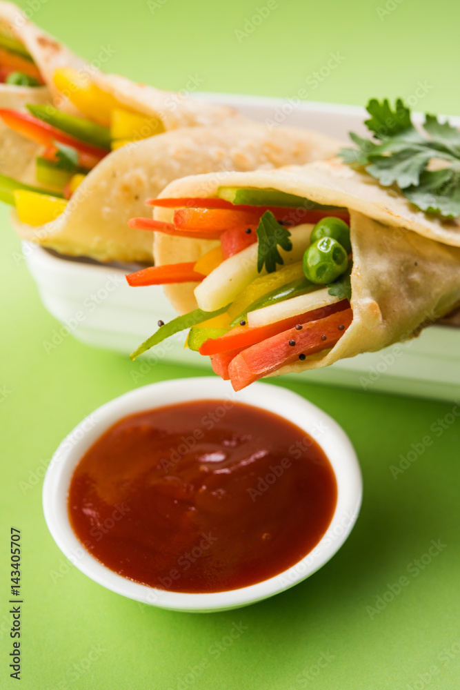 Indian popular snack food called Vegetable spring rolls or veg franky ...