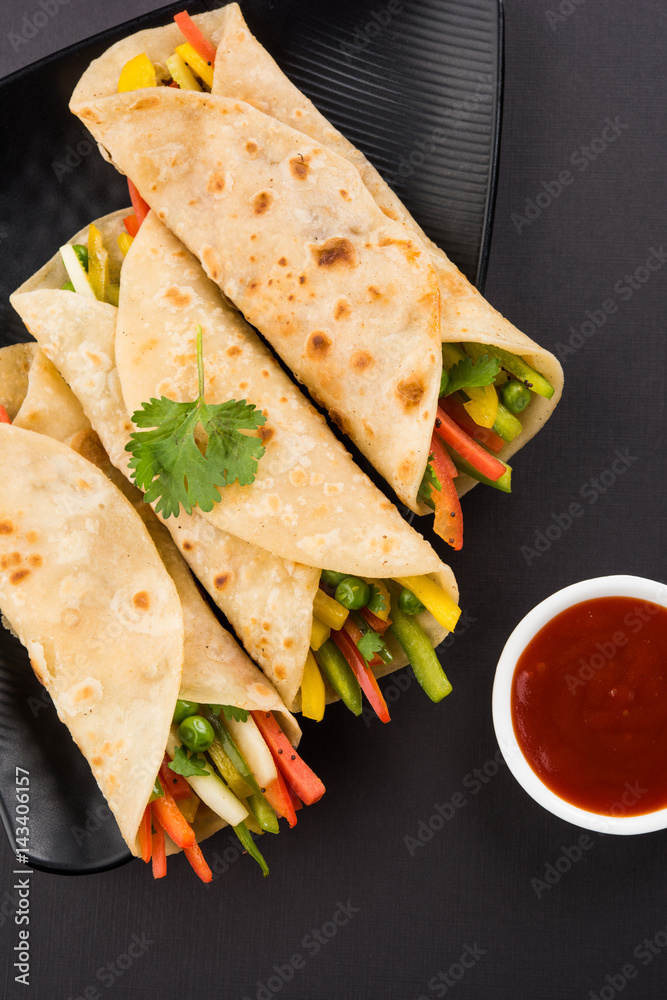Indian popular snack food called Vegetable spring rolls or veg franky ...