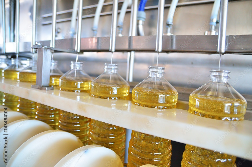 Sunflower oil. Factory line of production and filling of refined oil ...