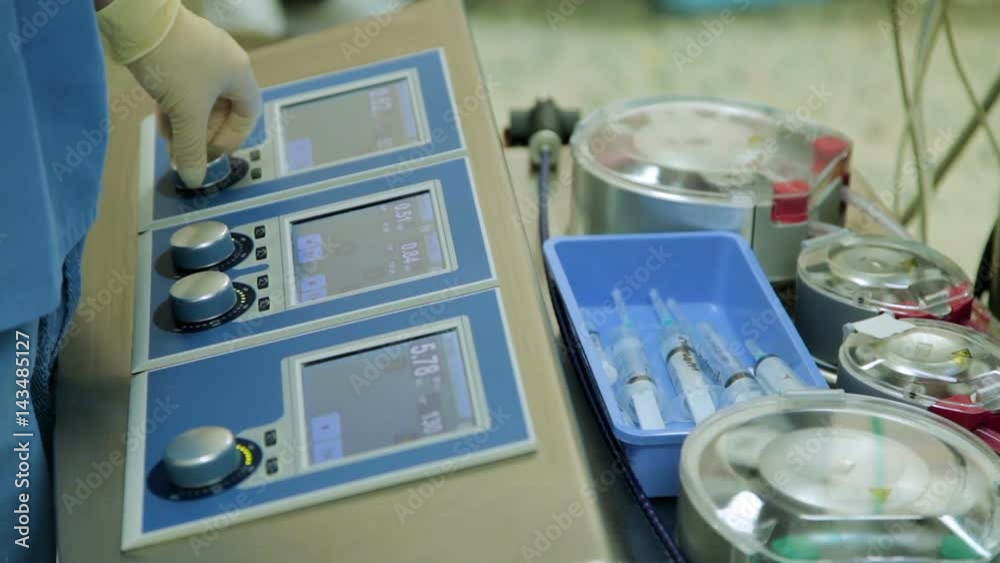 Perfusionist control heart lung machine in operating room. Close-up ...