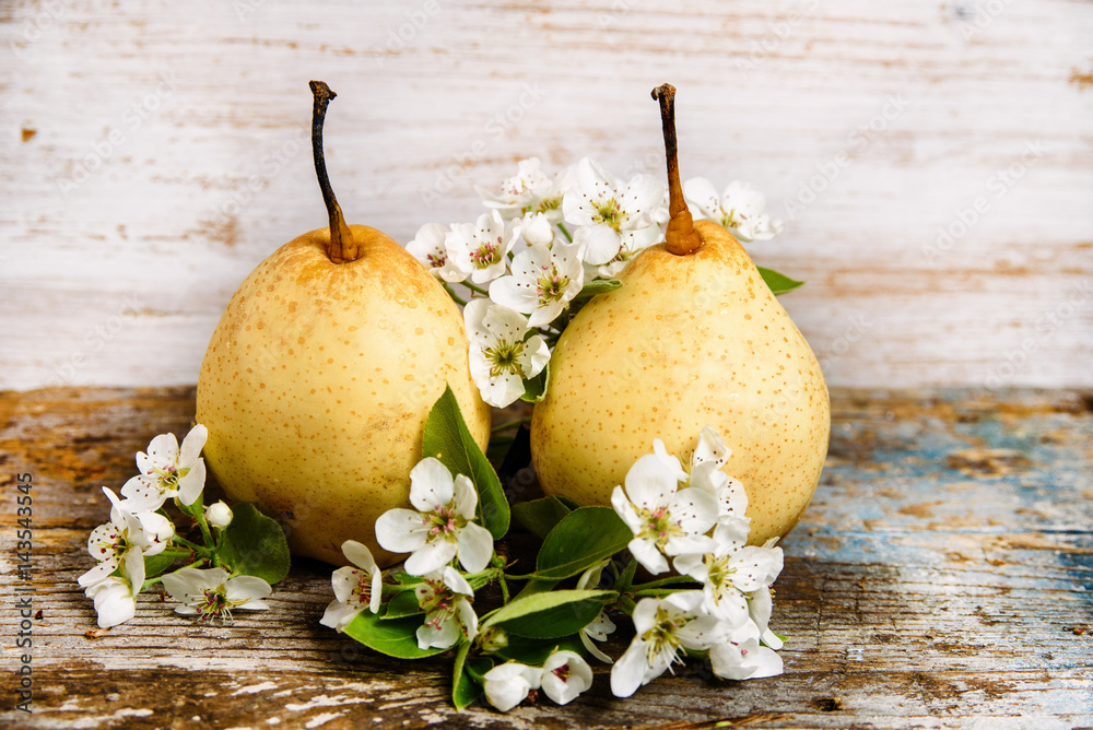yellow pears and pear flowers on vintage wood background Stock Photo ...