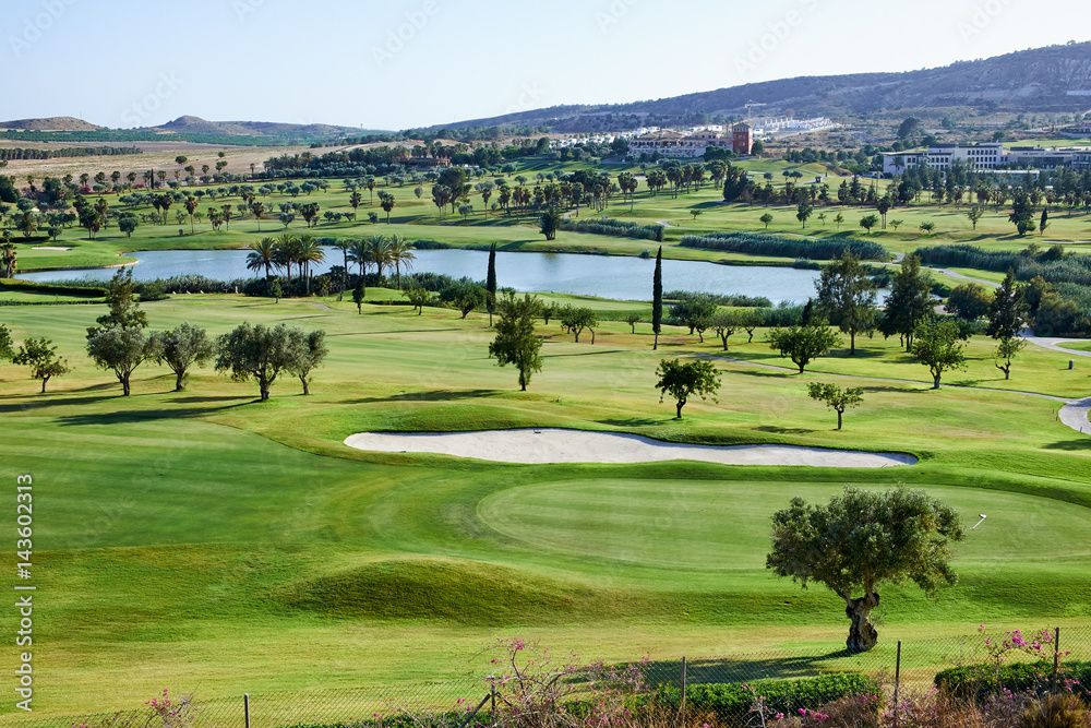 Golf course with gorgeous green and pond. Algorfa, Apain. Stock Photo ...
