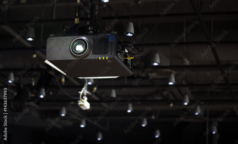 Projector in office room ready for presentation\ Stock Photo | Adobe Stock