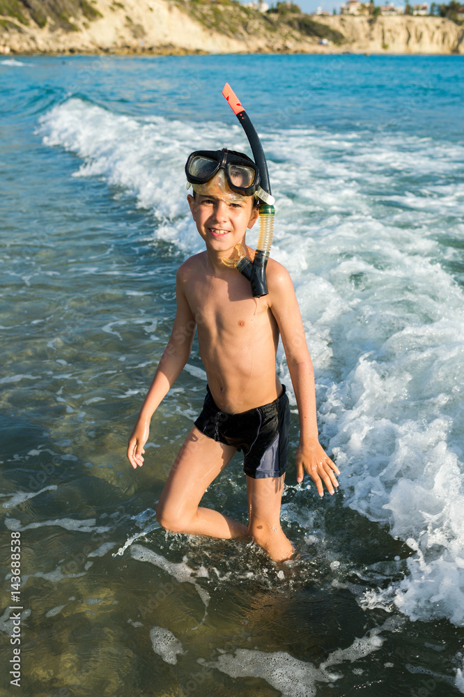 Boy in a mask on the beach Stock Photo | Adobe Stock