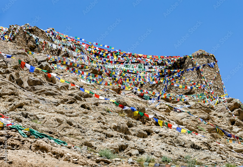 Tibetan ritual prayer flags hung on top of a mountain near Namgyal ...