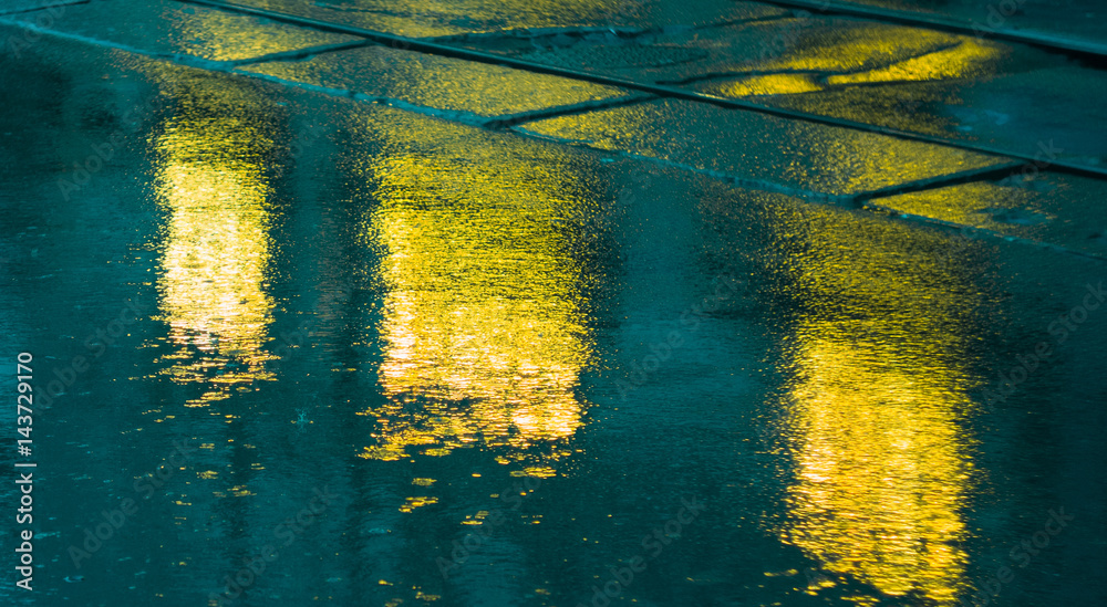 Pavement after the rain with light reflections Stock Photo | Adobe Stock