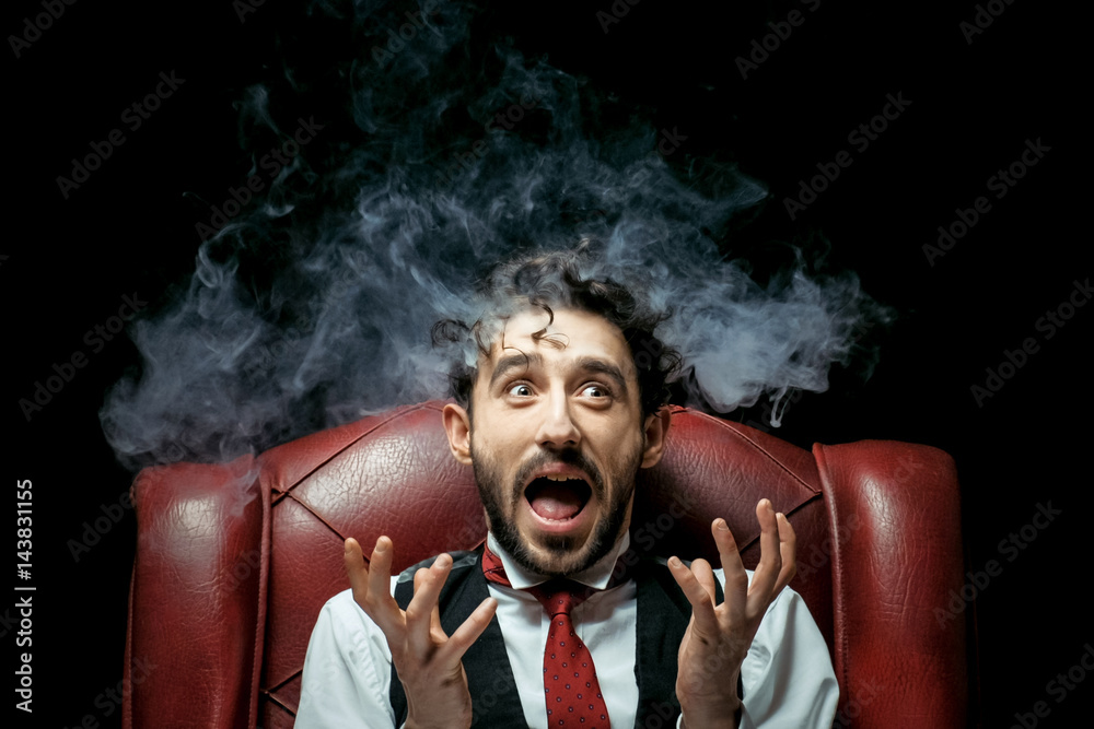 Stressed businesswoman with smoke coming out of his ears foto de Stock ...