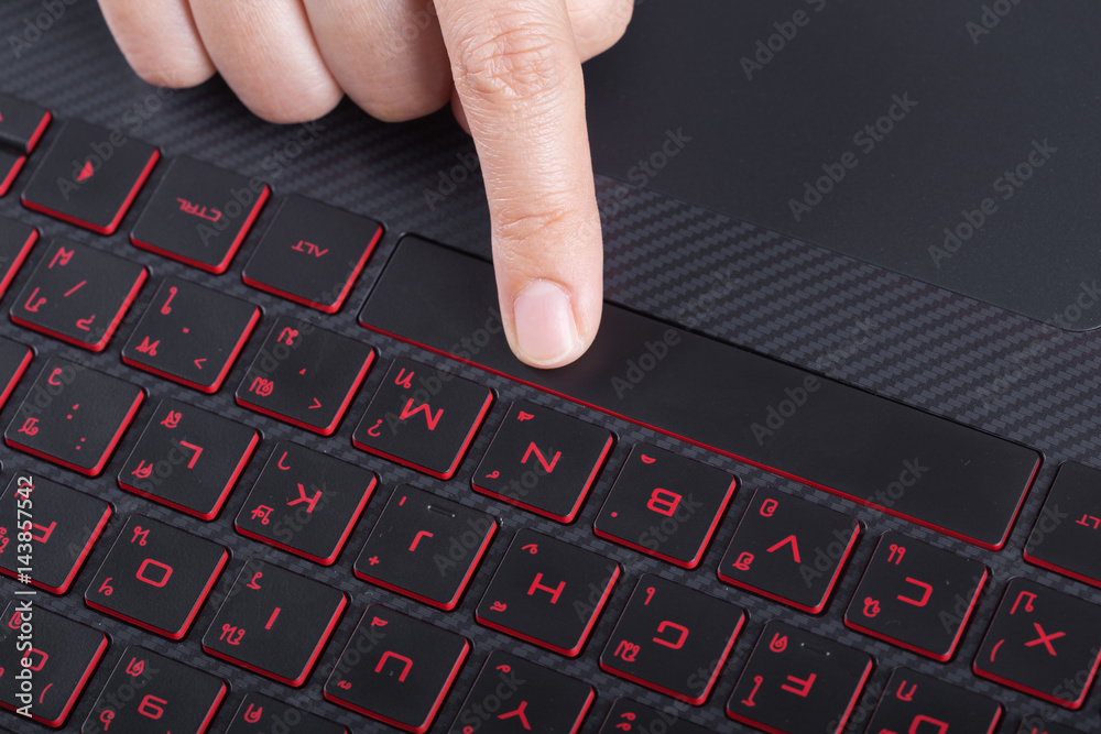 finger pushing space bar button on laptop keyboard Stock Photo | Adobe ...