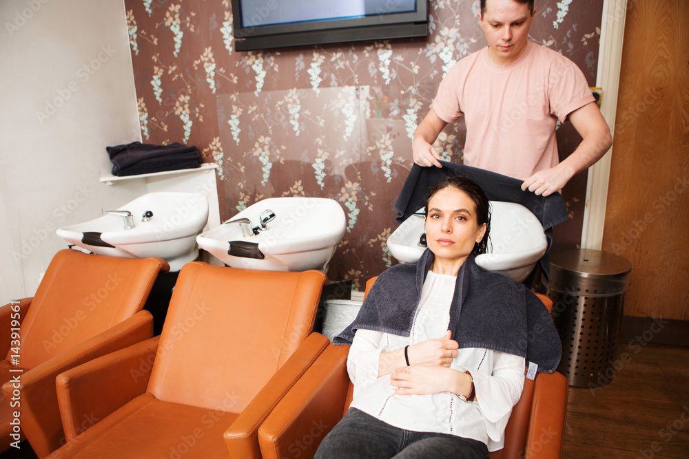 Female customer with wet hair at salon sink Stock Photo | Adobe Stock