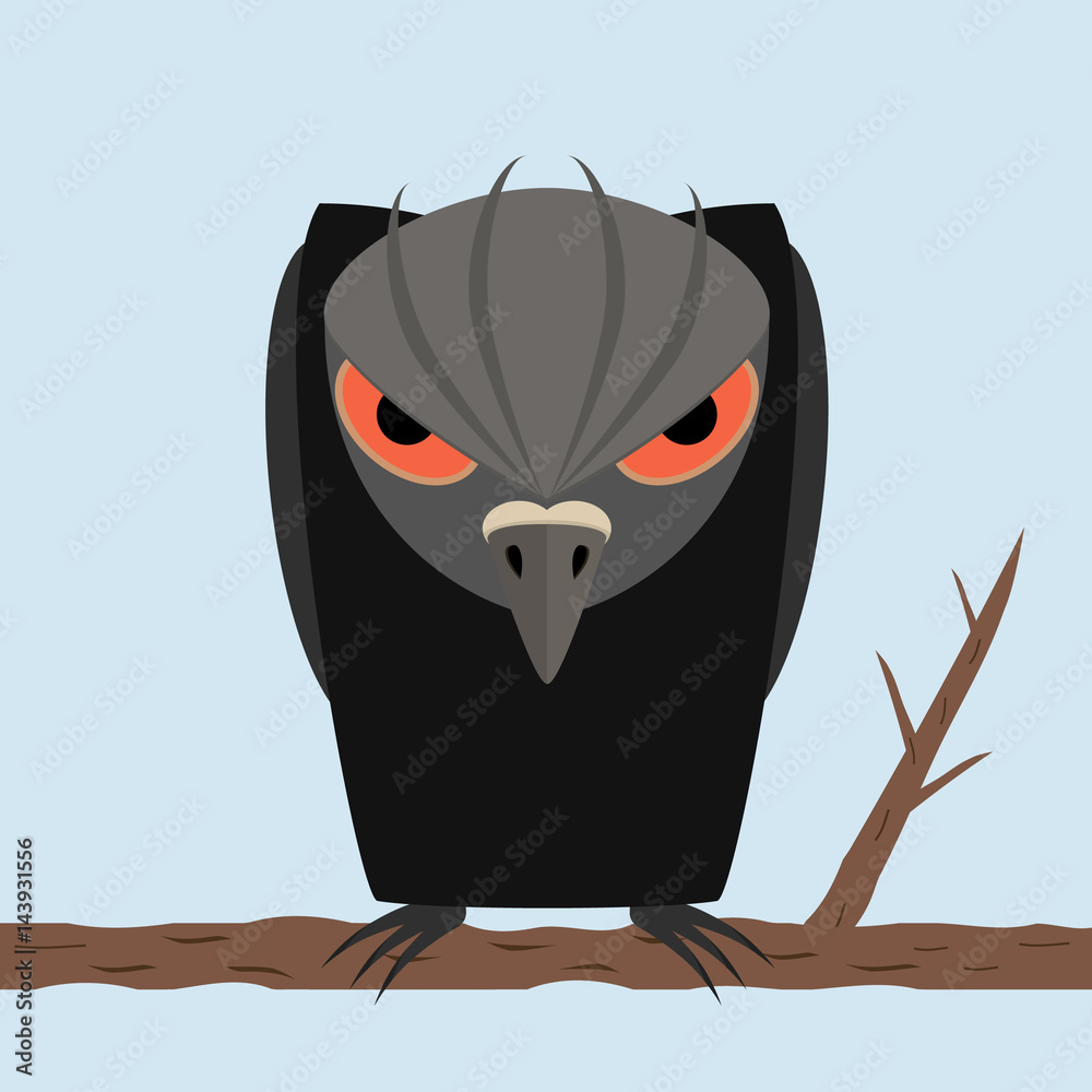 Angry black raven sits on a tree branch on blue sky background. A ...