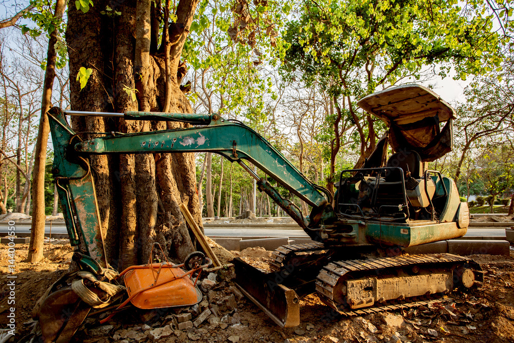 Excavator or backhoe at the construction site, sunset background, Track ...