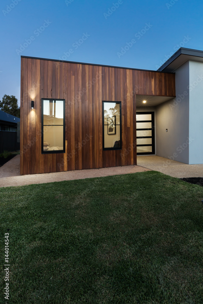 Vertical contemporary new home with wood cladding detail Stock Photo ...