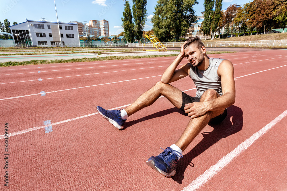 Young male athlete looking upset and devastated after losing in a ...