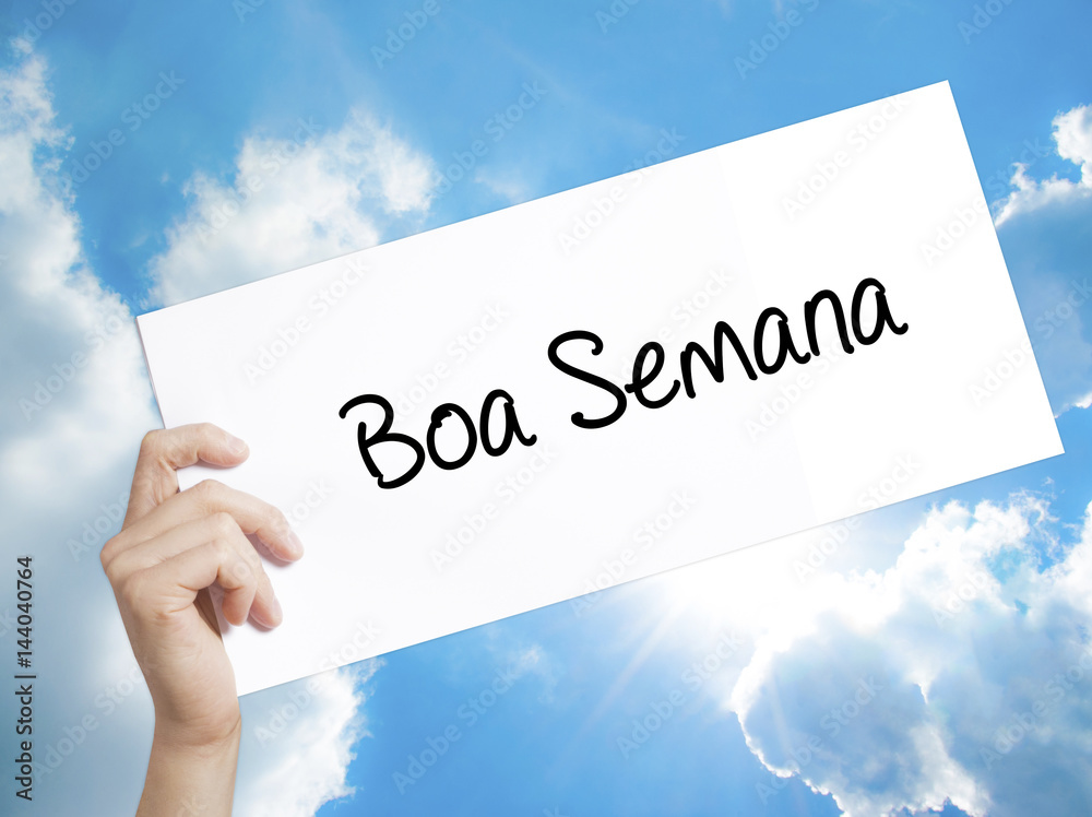 Boa semana (Good WeekIn portuguese)Sign on white paper. Man Hand ...