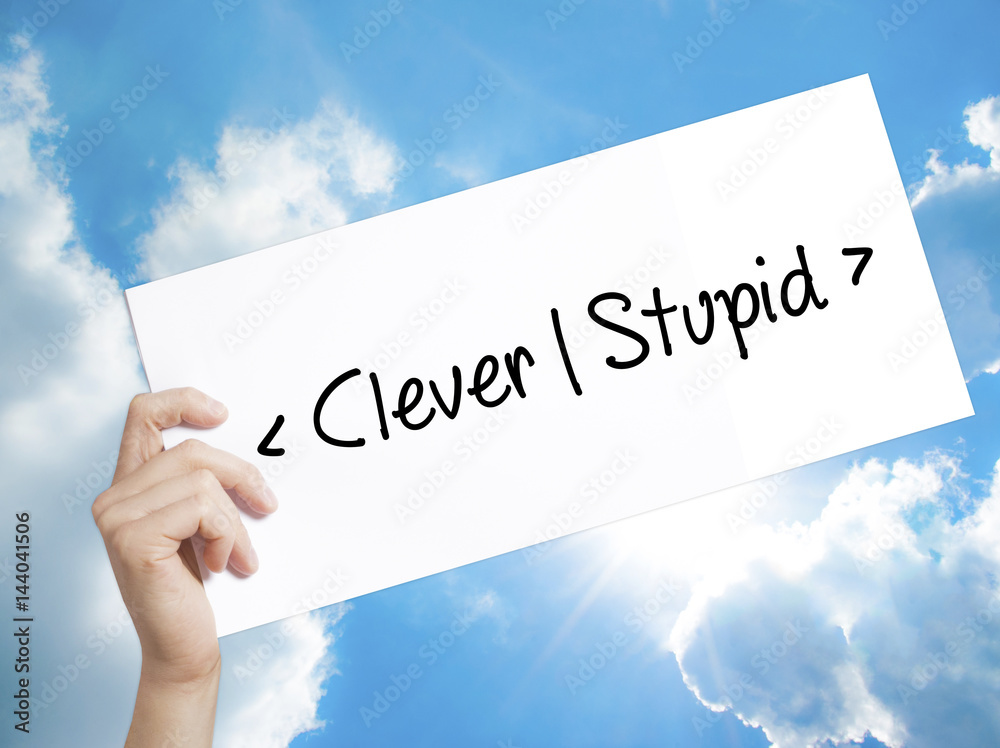 Clever - Stupid Sign on white paper. Man Hand Holding Paper with text ...