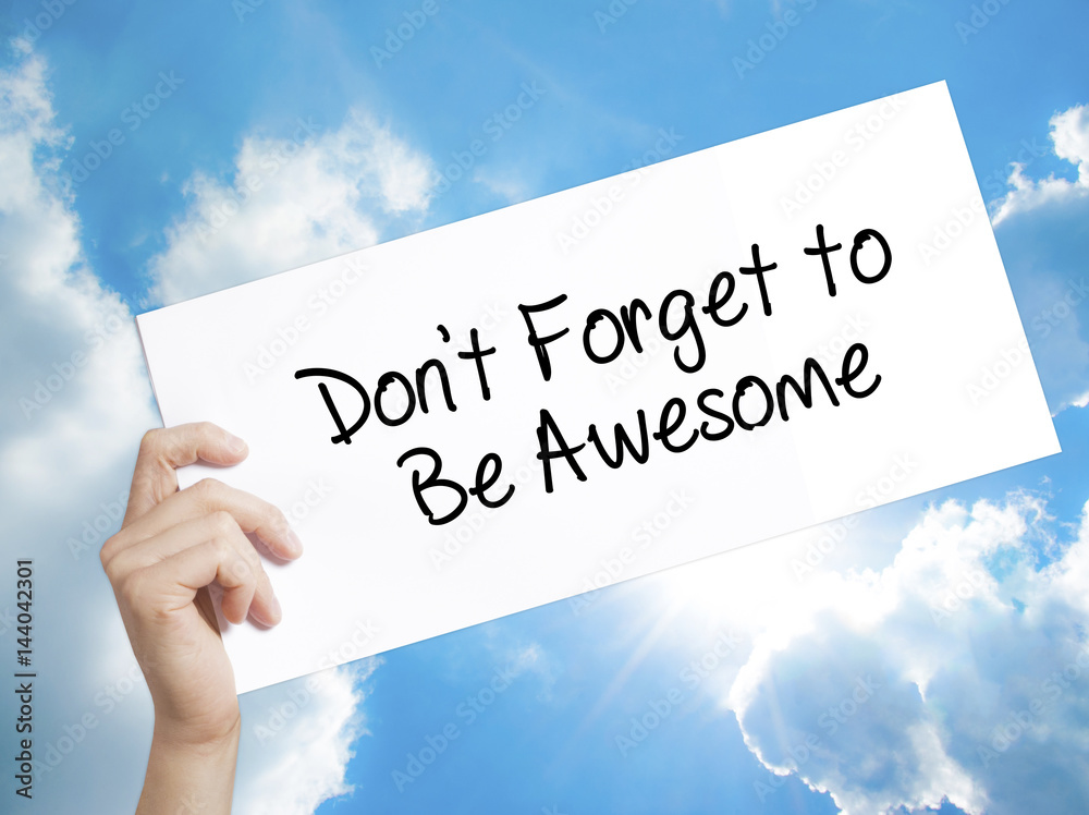 Don't Forget to Be Awesome Sign on white paper. Man Hand Holding Paper ...