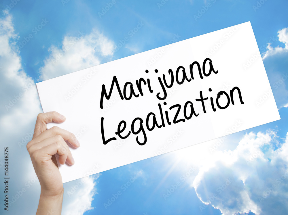 Marijuana Legalization Sign on white paper. Man Hand Holding Paper with ...