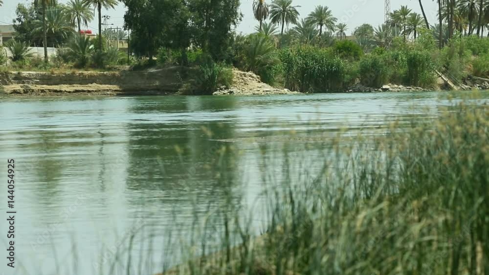Tilt down to Euphrates river at Karbala, Iraq. The Euphrates is the ...