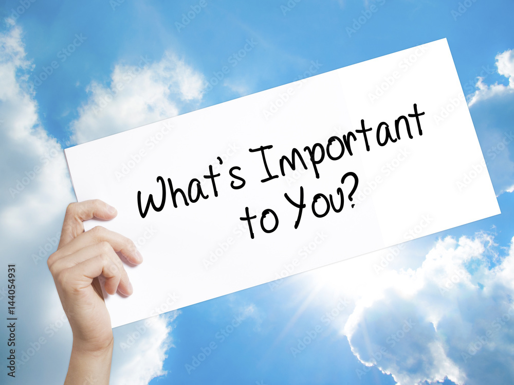 What's Important to You? Sign on white paper. Man Hand Holding Paper ...
