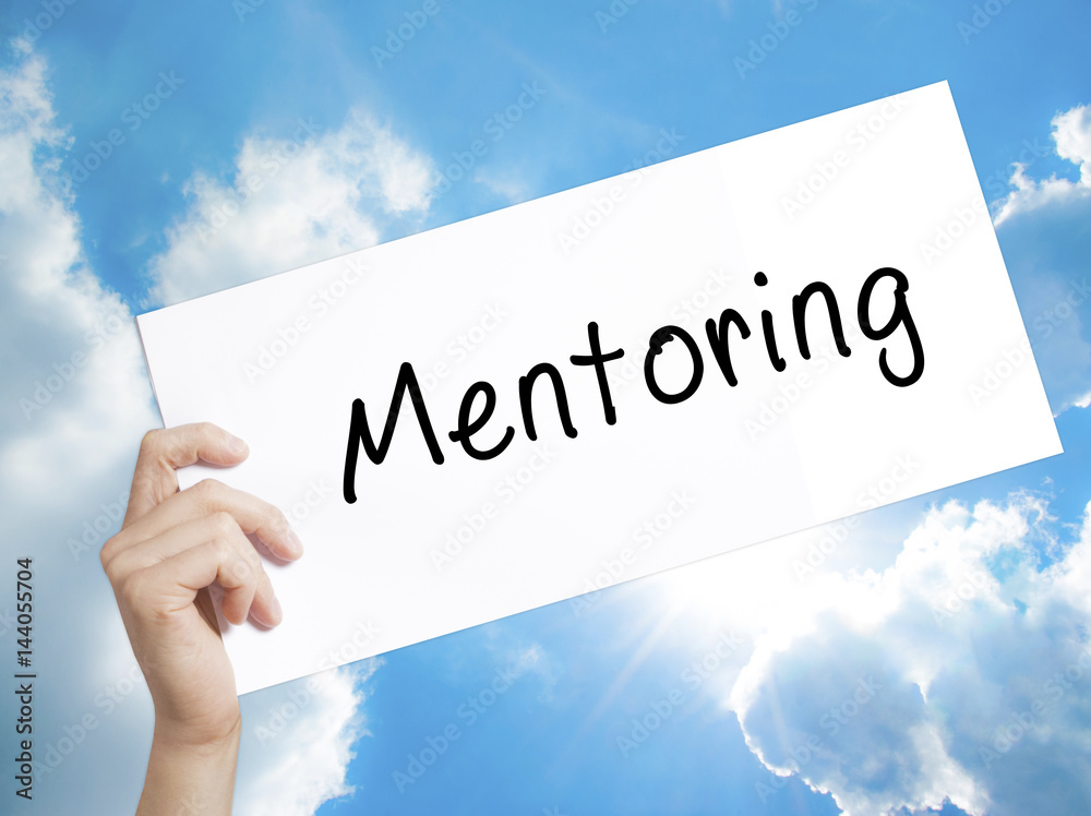 Mentoring Sign on white paper. Man Hand Holding Paper with text ...