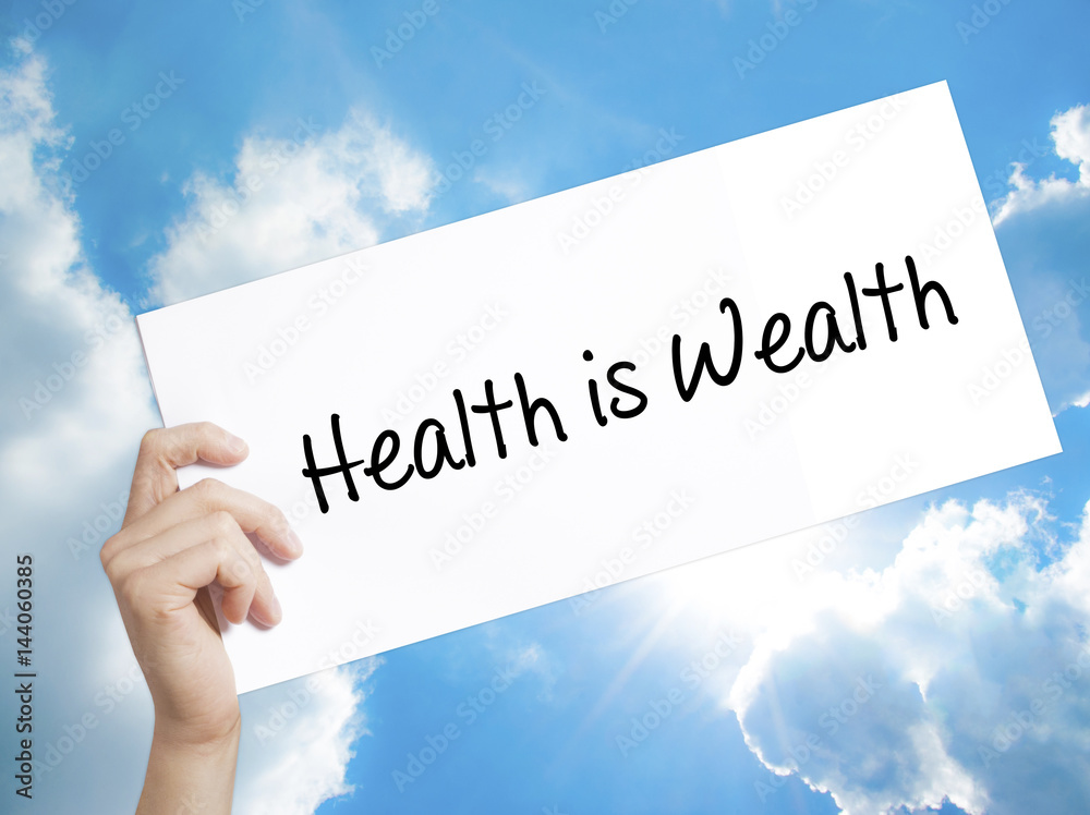 Health is Wealth Sign on white paper. Man Hand Holding Paper with text ...