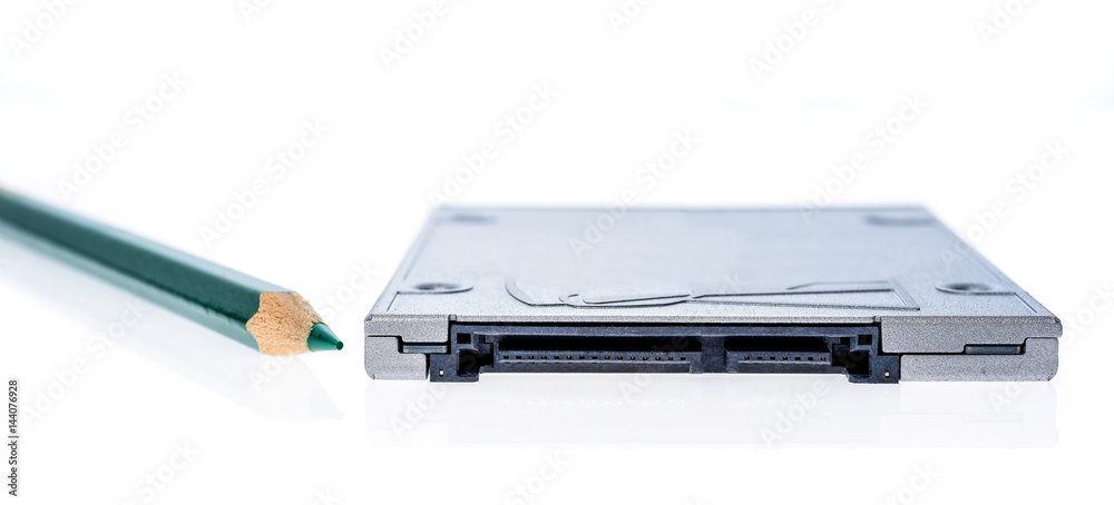 Solid state drive SSD next to a pencil size comparison. Stock Photo ...