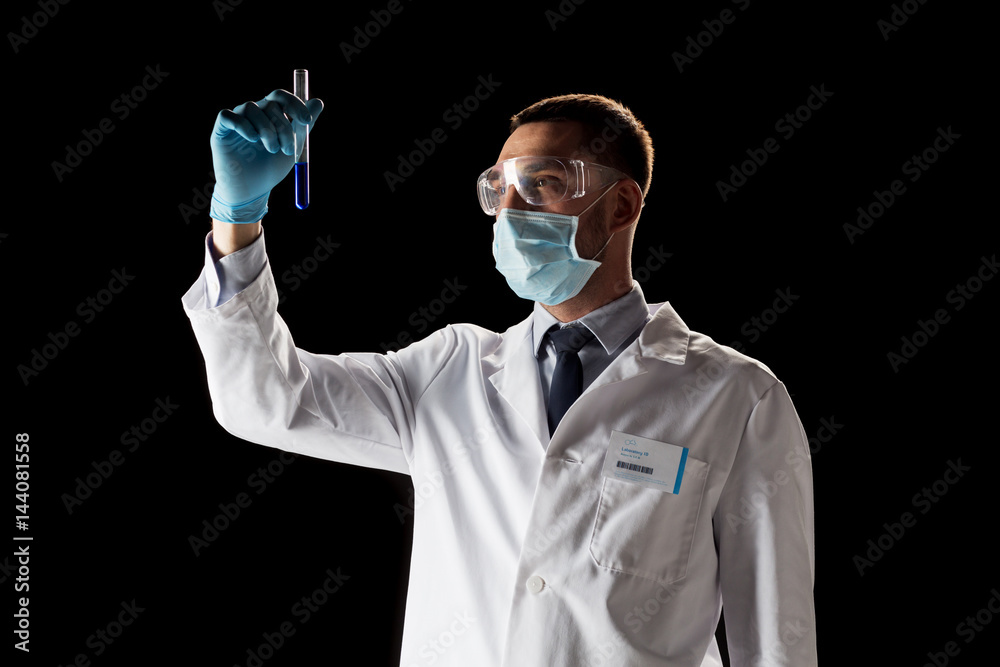 scientist with safety glasses, mask and test tube Stock Photo | Adobe Stock