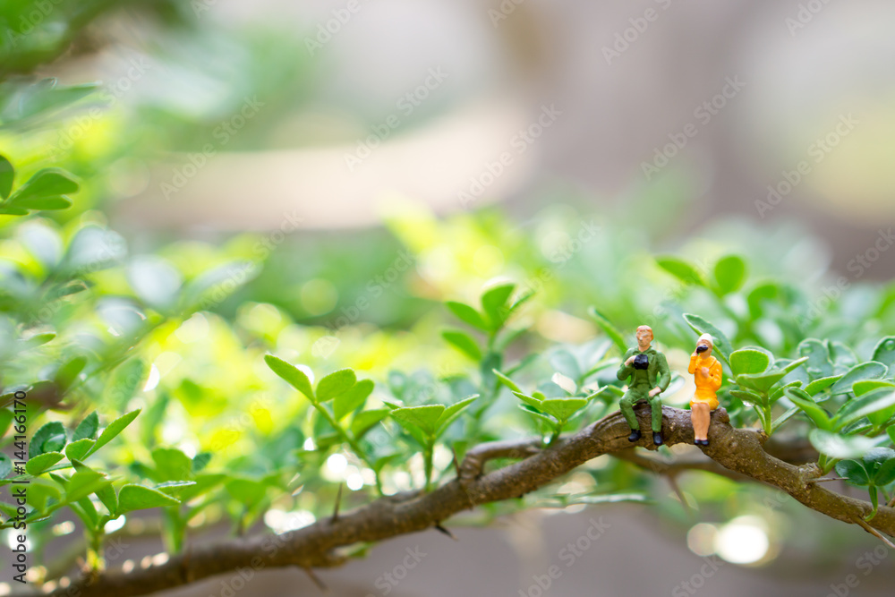 Miniature people lover relax on the tree Stock Photo | Adobe Stock